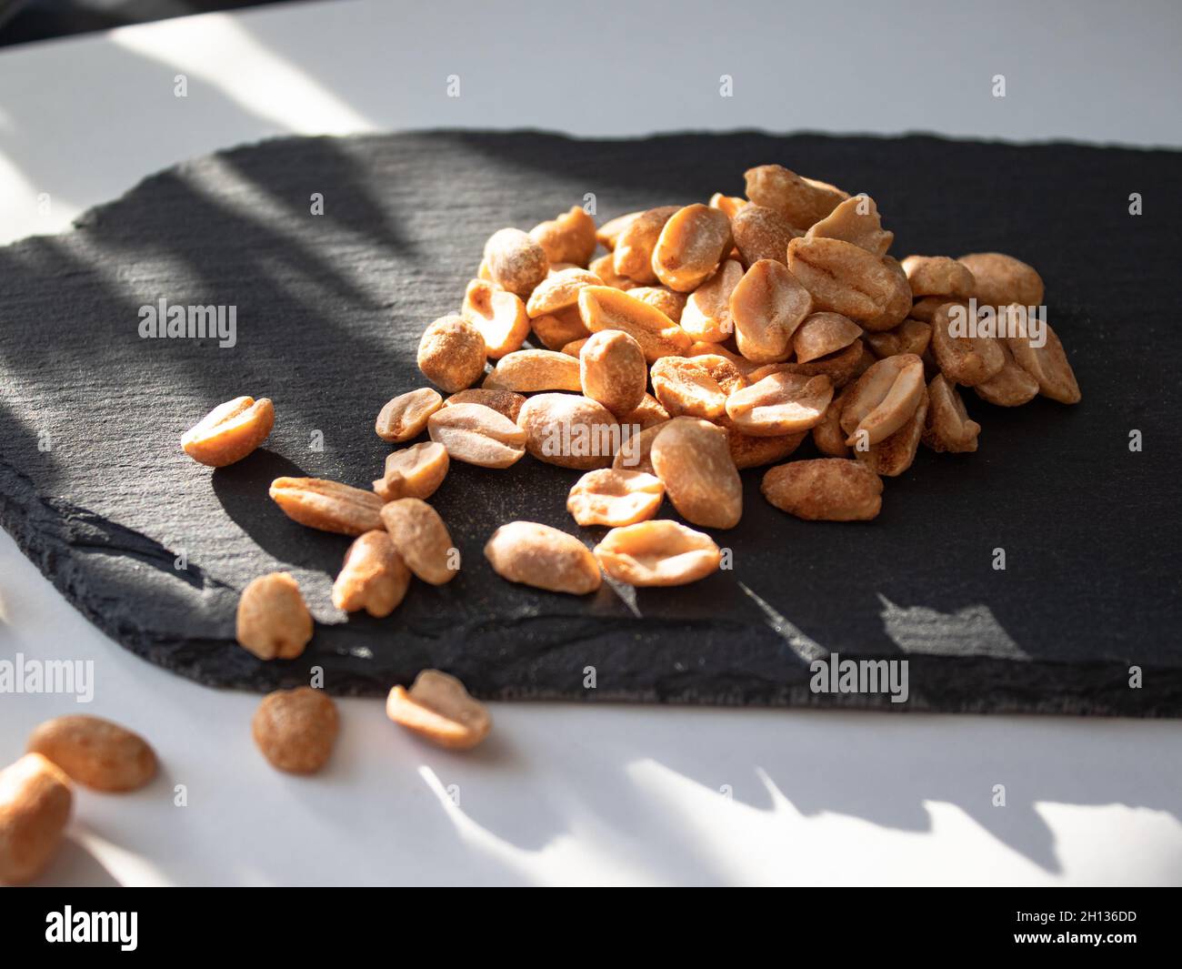 Chili lemon peanuts on stone cutting board Stock Photo - Alamy