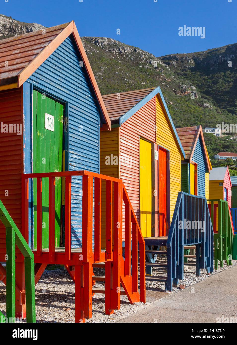 Brightly painted wooden bathing huts at St James Beach, near Cape Town ...