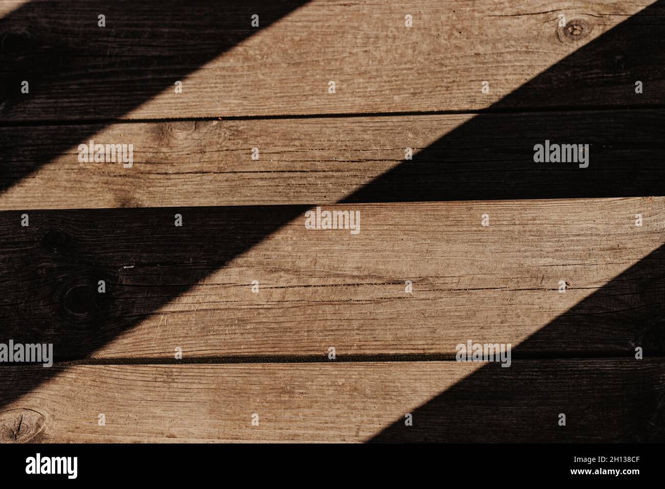 Abstract wooden background with hard shadows. Geometric shapes of light ...