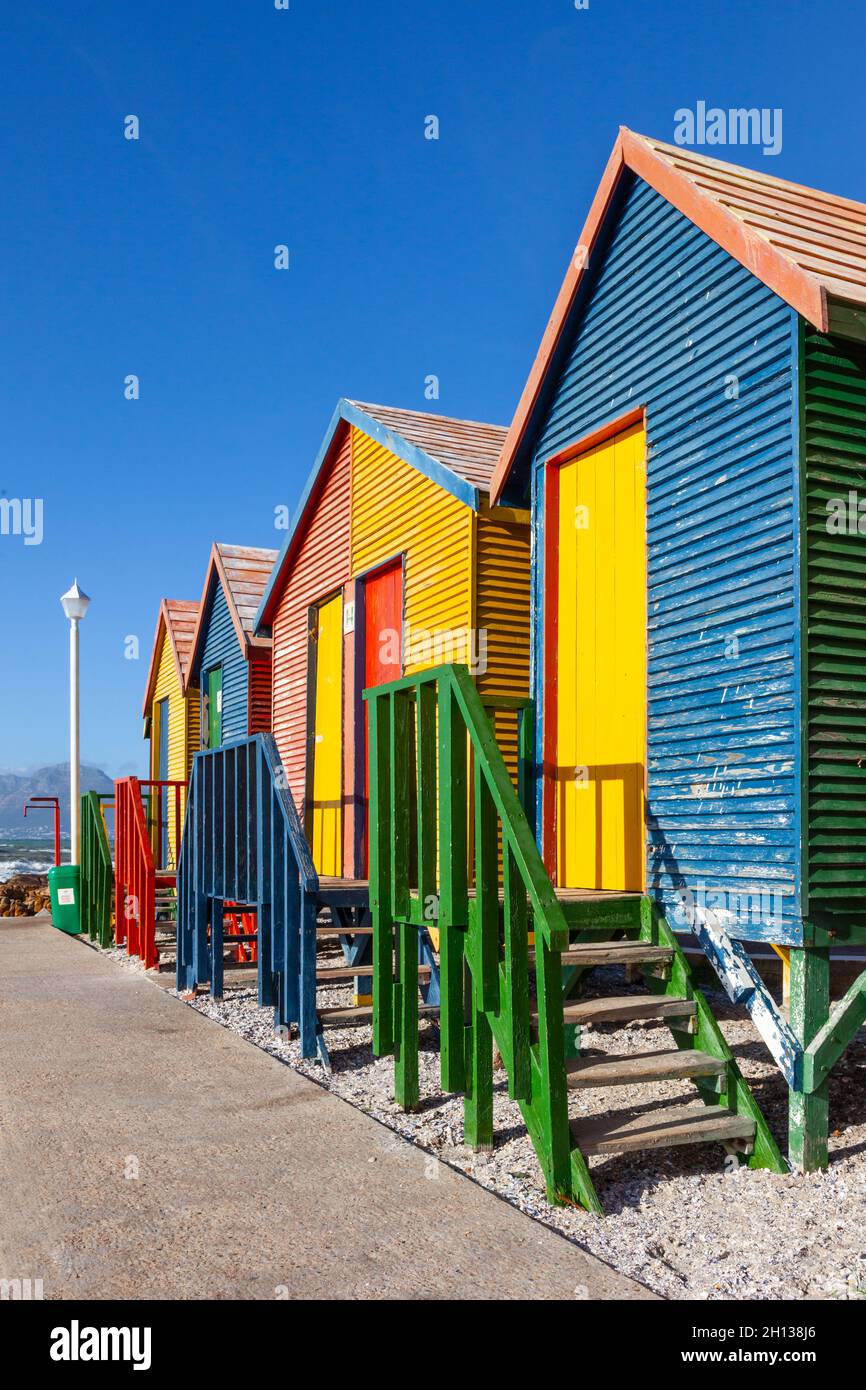 Brightly painted wooden bathing huts at St James Beach, near Cape Town ...