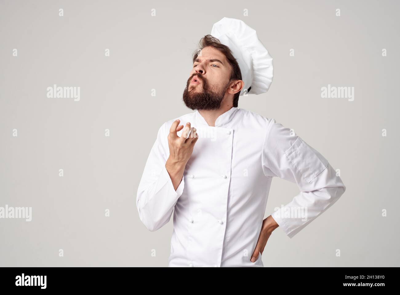 male cook kitchen Job hand gestures light background Stock Photo - Alamy