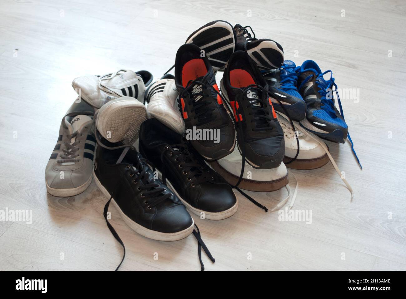 a stack of different sports shoes and sneakers Stock Photo - Alamy