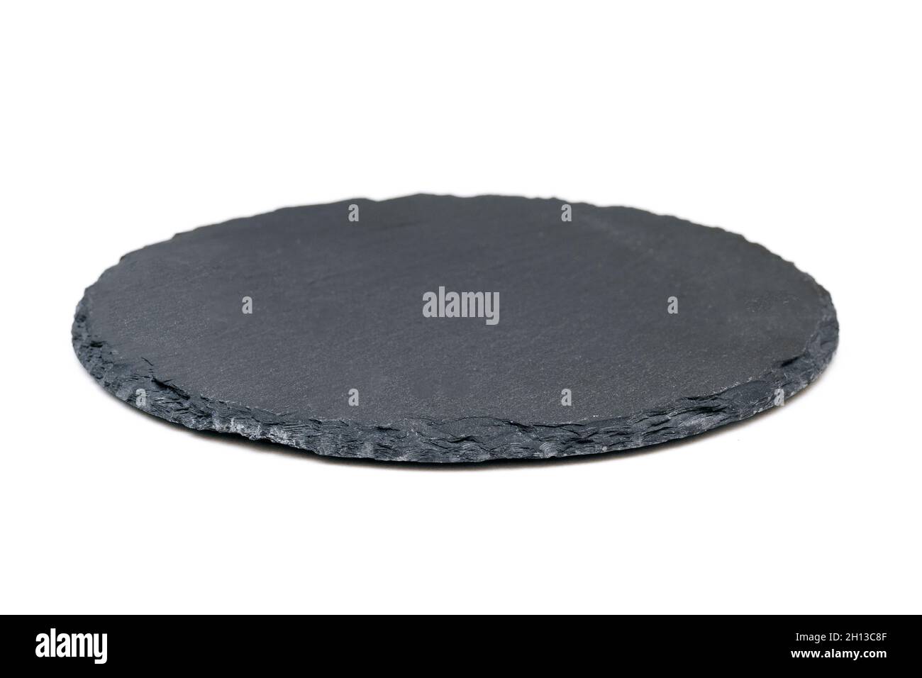 Natural black stone slate as a tray. Side view of slate board isolated ...