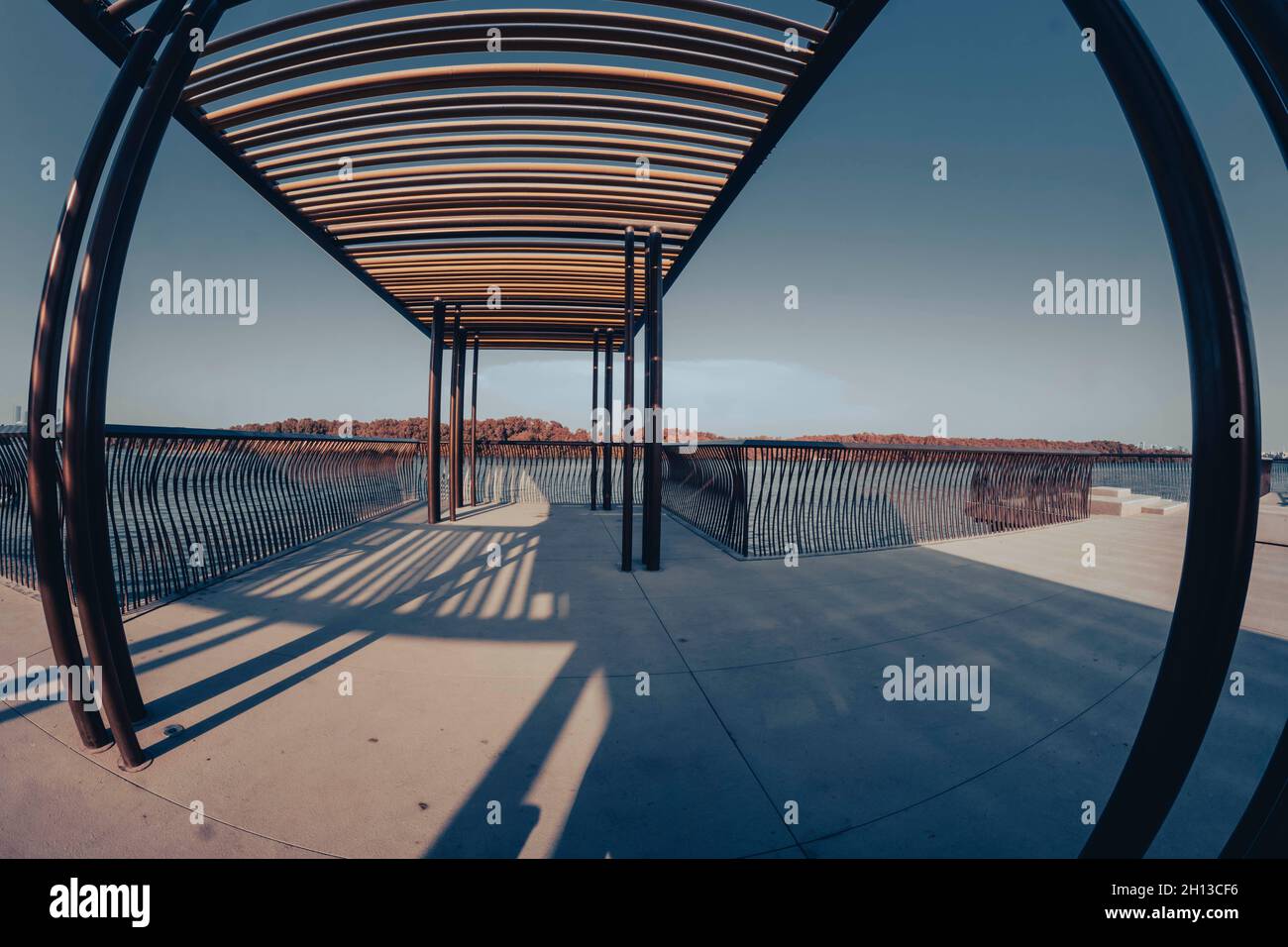 An artistic fisheye view of a pavillion looking over the water, rest ...