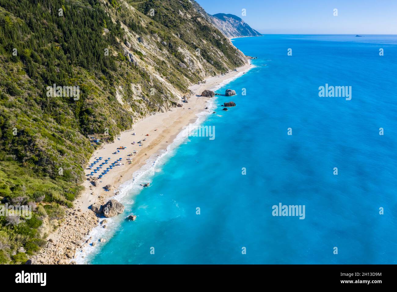 Aerial view of Kalamitsi beach with big boulders in turquoise blue ...