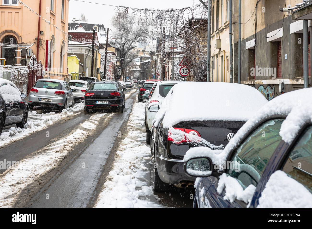 BUCHARE, ROMANIA - Sep 01, 2021: The snowing on cars in the morning ...