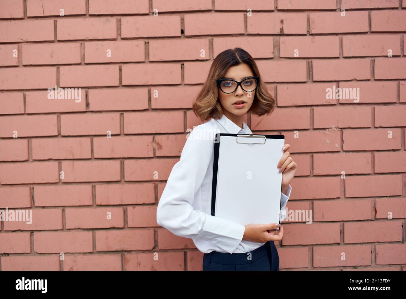 Business woman documents office work professional brick wall Stock ...
