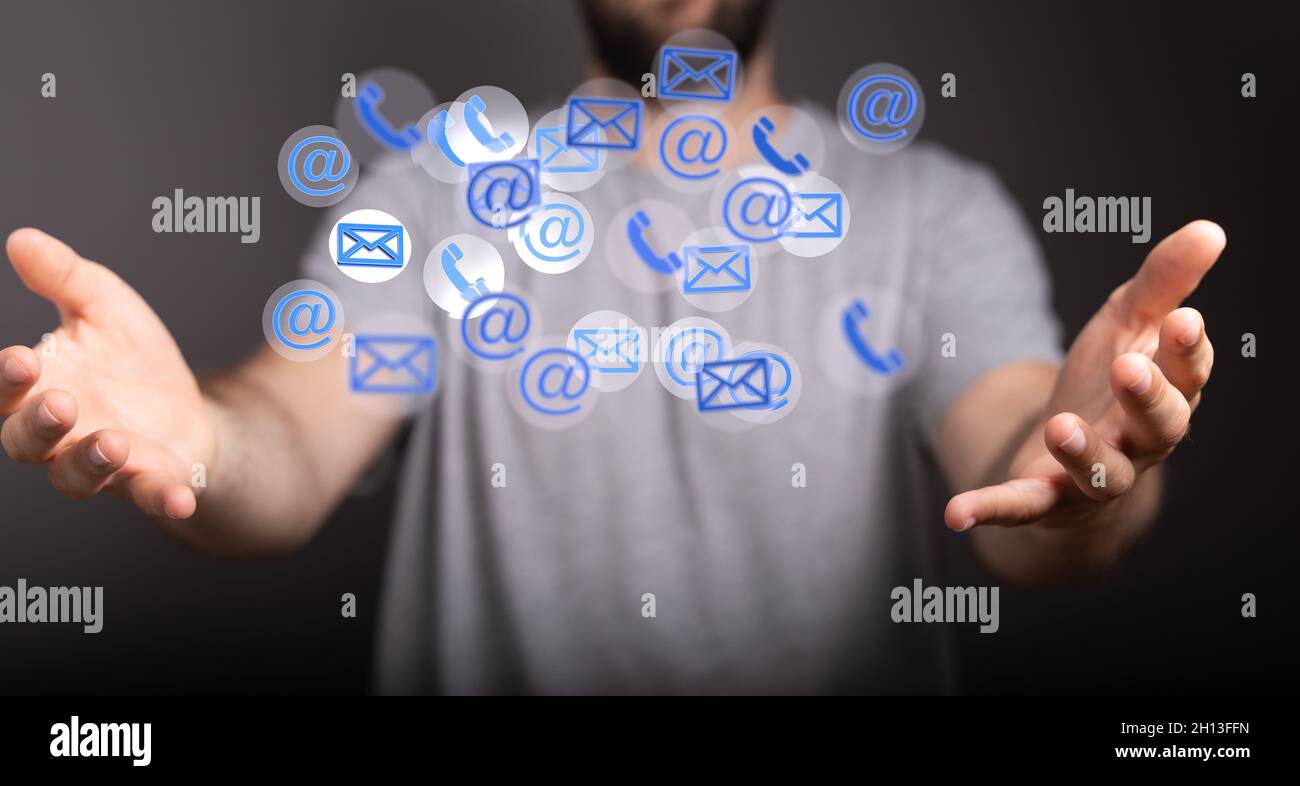 Abstract shot of a man's hand showing 3D rendered digital email and ...