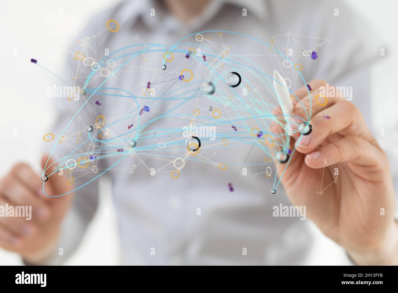 Abstract shot of a man's hands presenting digital networking ...