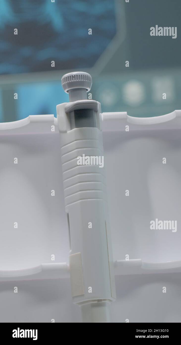 Close up of biochemistry pipette for liquid test analysis in scientific ...