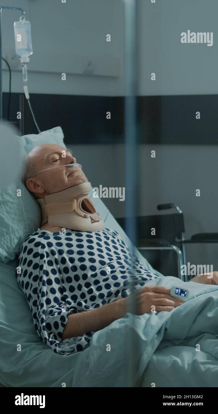 Sick patient recovering from injury with cervical collar for neck in ...