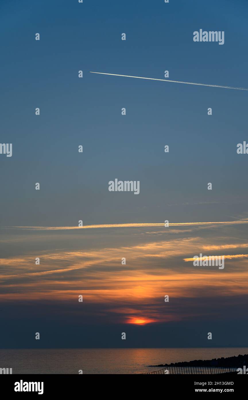 Aircraft contrails sunset hi-res stock photography and images - Alamy
