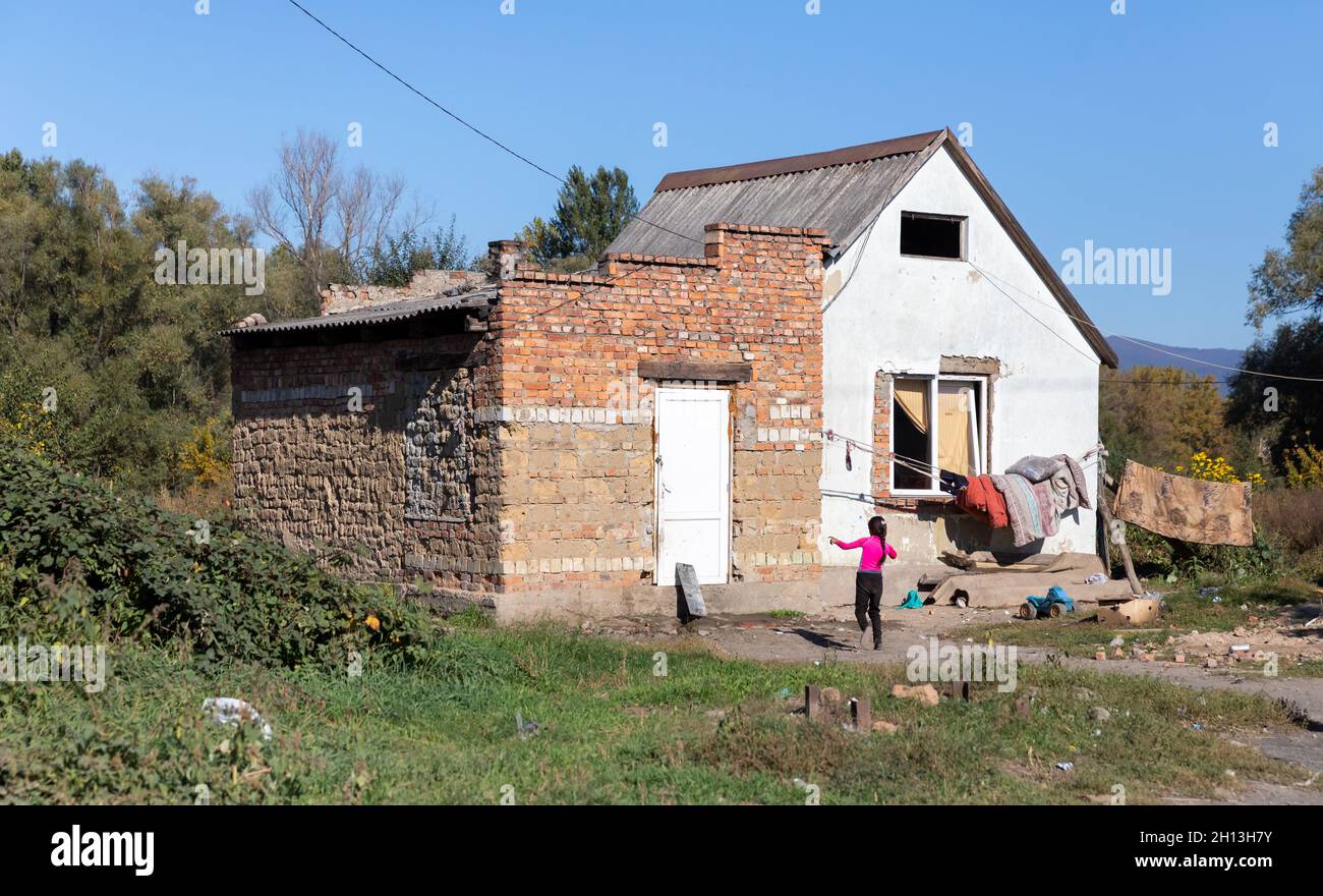 Roma houses. Gypsy slums on the outskirts of Uzhgorod in a roma village ...