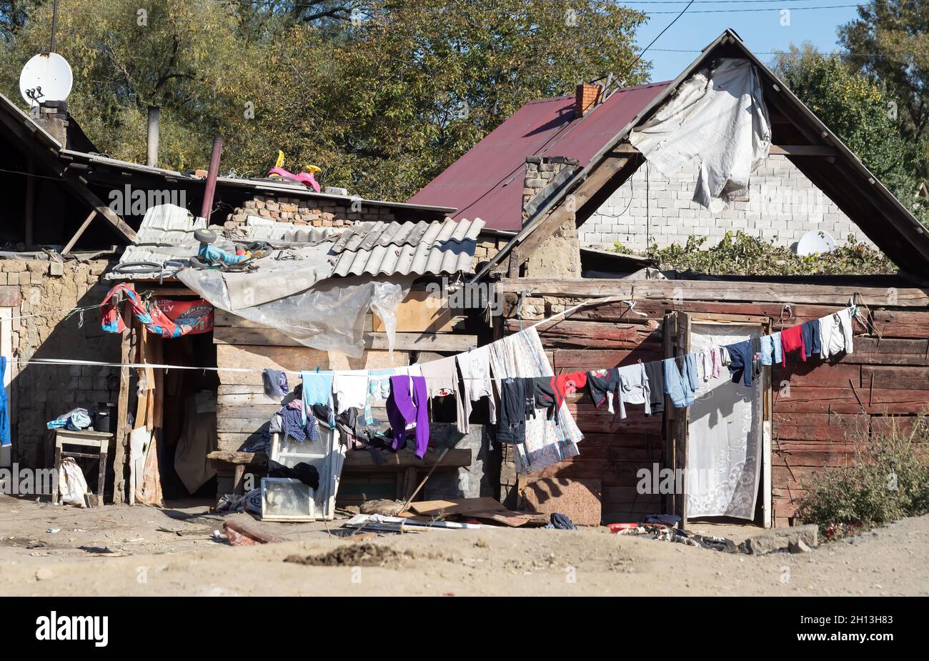 Roma houses. Gypsy slums on the outskirts of Uzhgorod in a roma village ...