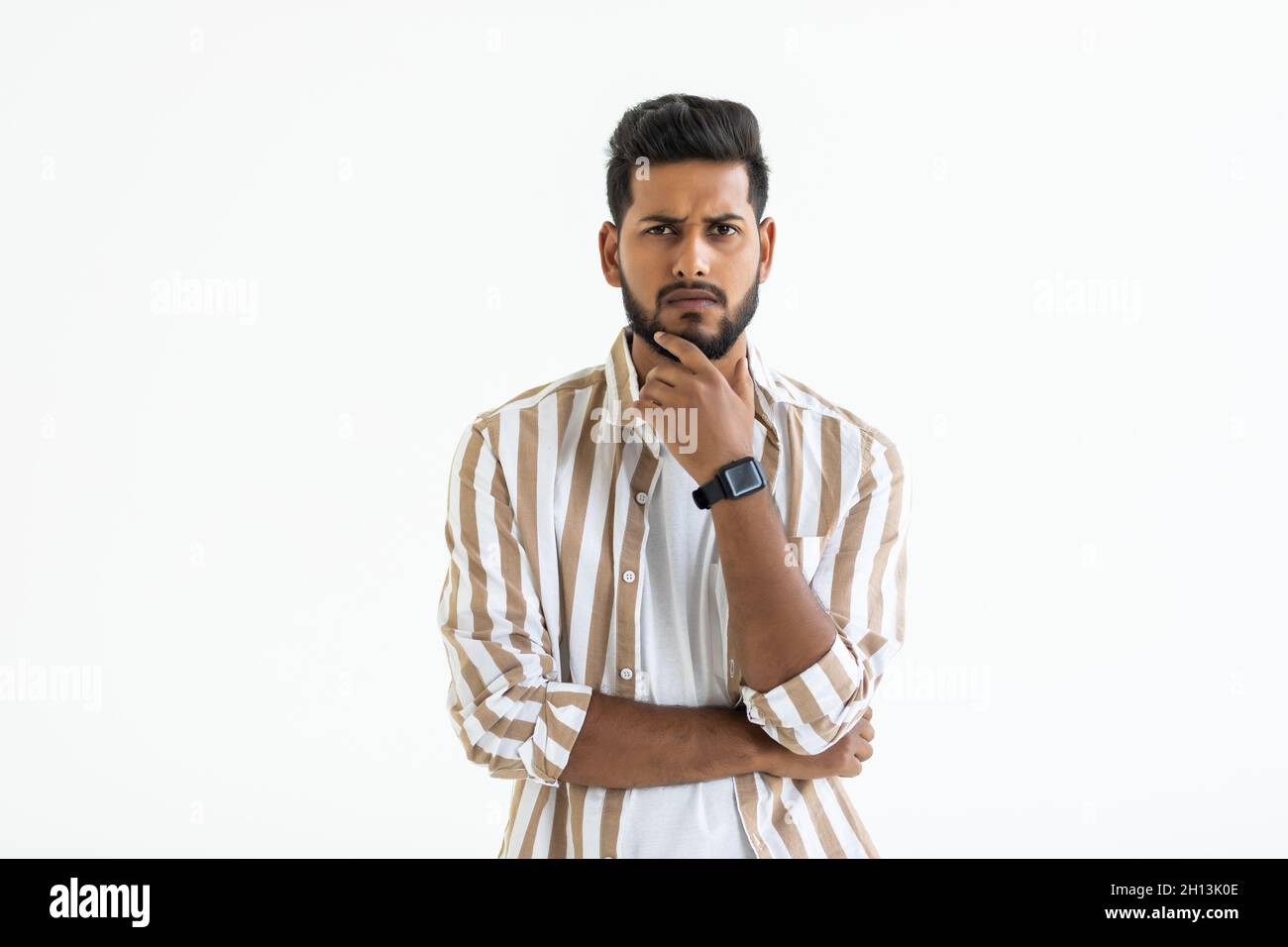 young man thinking on a white background Stock Photo - Alamy