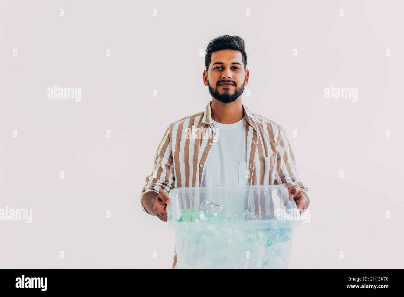 Recycling man isolated on white background Stock Photo - Alamy