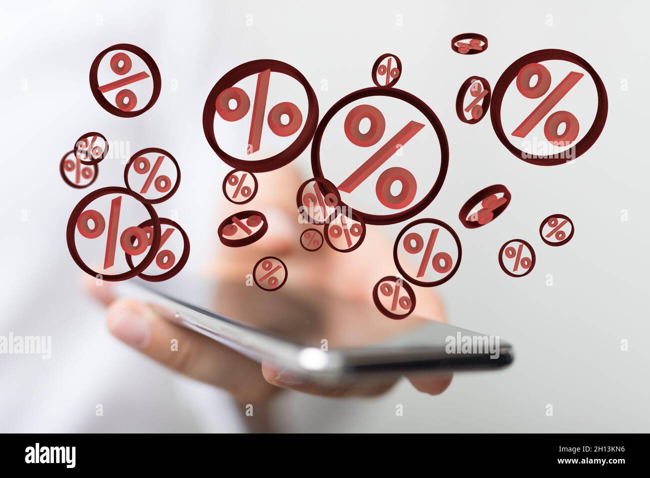 Abstract shot of a man's hand showing 3D rendered percent and interest ...