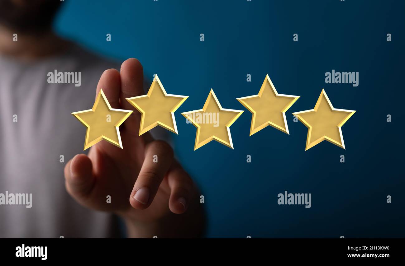 Abstract shot of man touching 3D rendered golden rating stars with a 5 ...