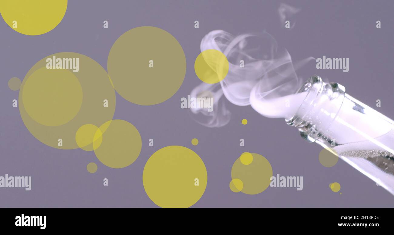 Image of glowing yellow spots falling over champagne cork exploding ...