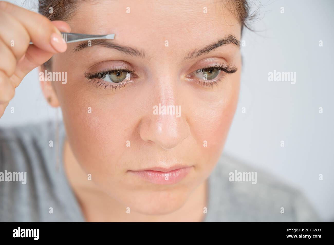 Woman pull hair mirror hi-res stock photography and images - Alamy