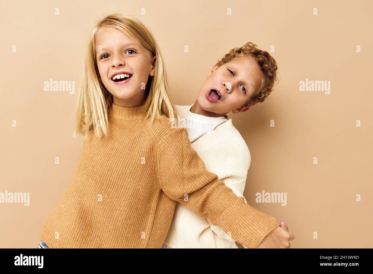 portrait of cute children with light brown hair beige background Stock ...