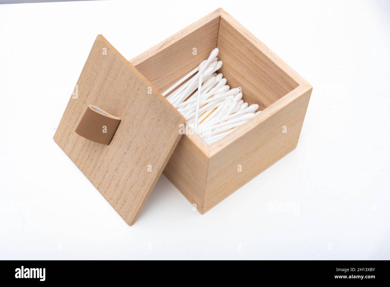 an open wooden box with cotton buds in it, isolated Stock Photo - Alamy