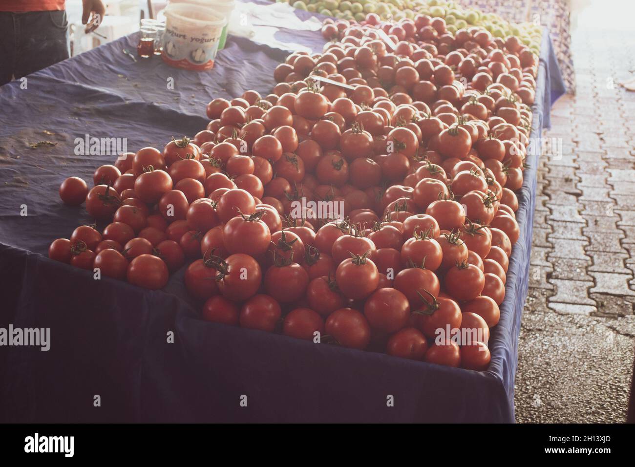 Ripe tomatoes on display at farmer's market on summer day. Healthy ...