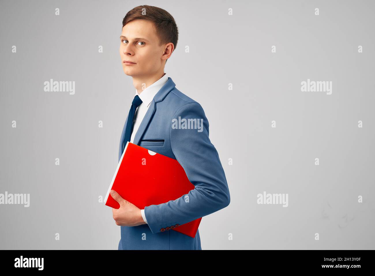 man in suit with red folder documents office official Stock Photo - Alamy