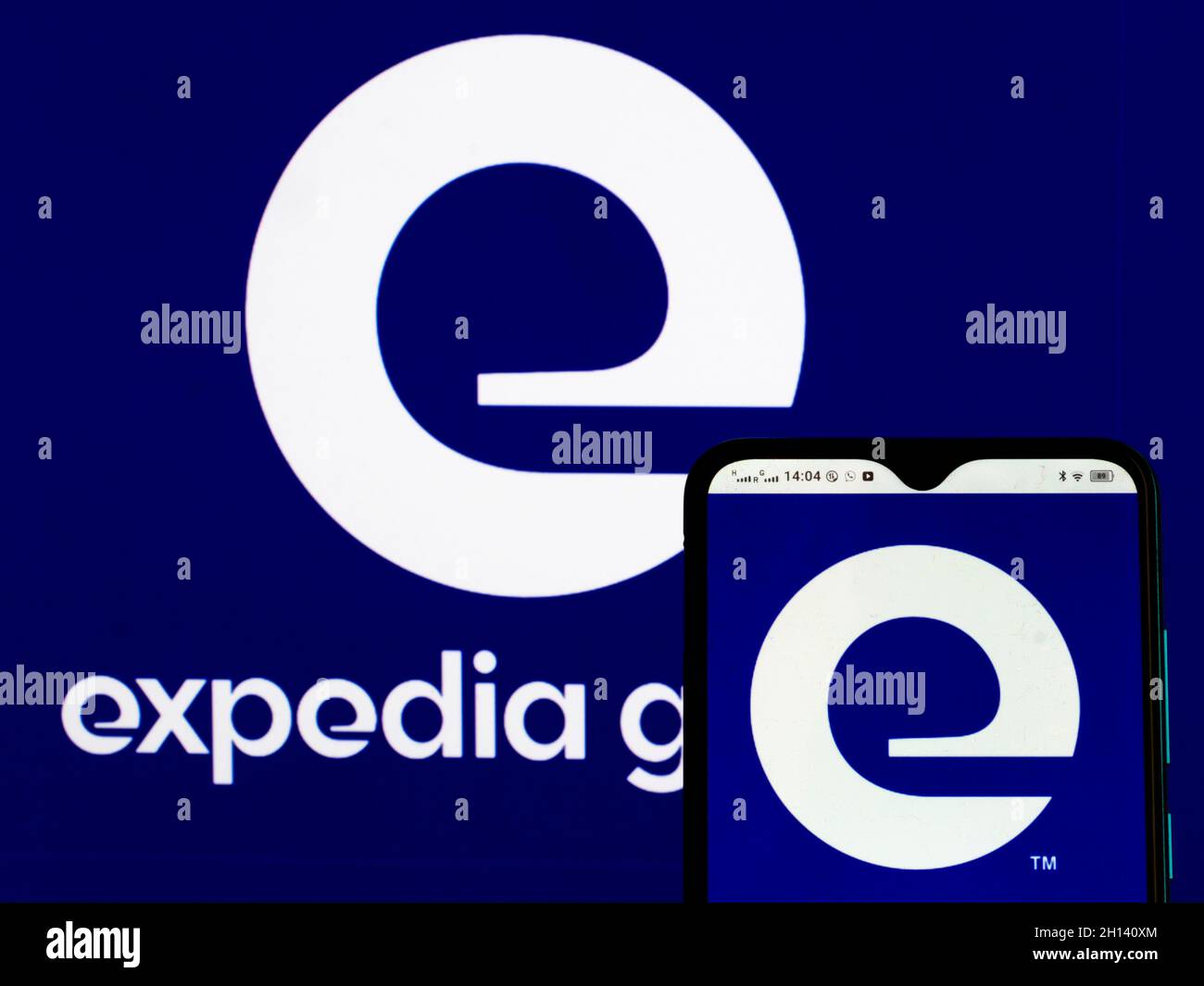 In this photo illustration Expedia Group logo seen displayed on a ...