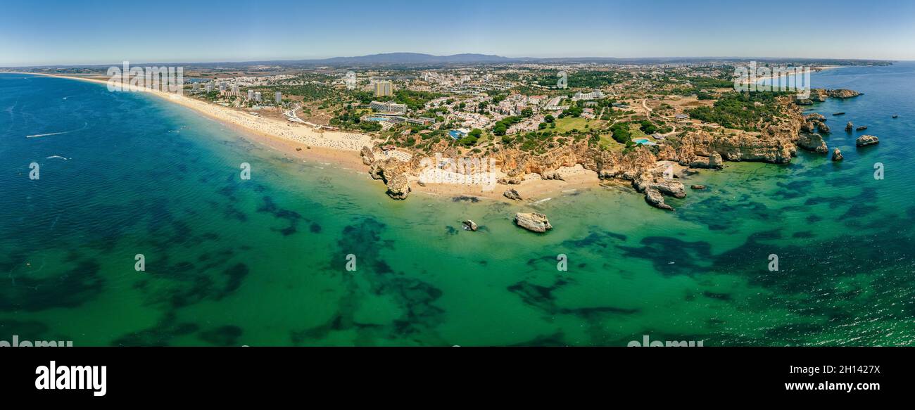 Aerial and panoramic view of Praia dos Tres Irmaos beach, Alvor ...