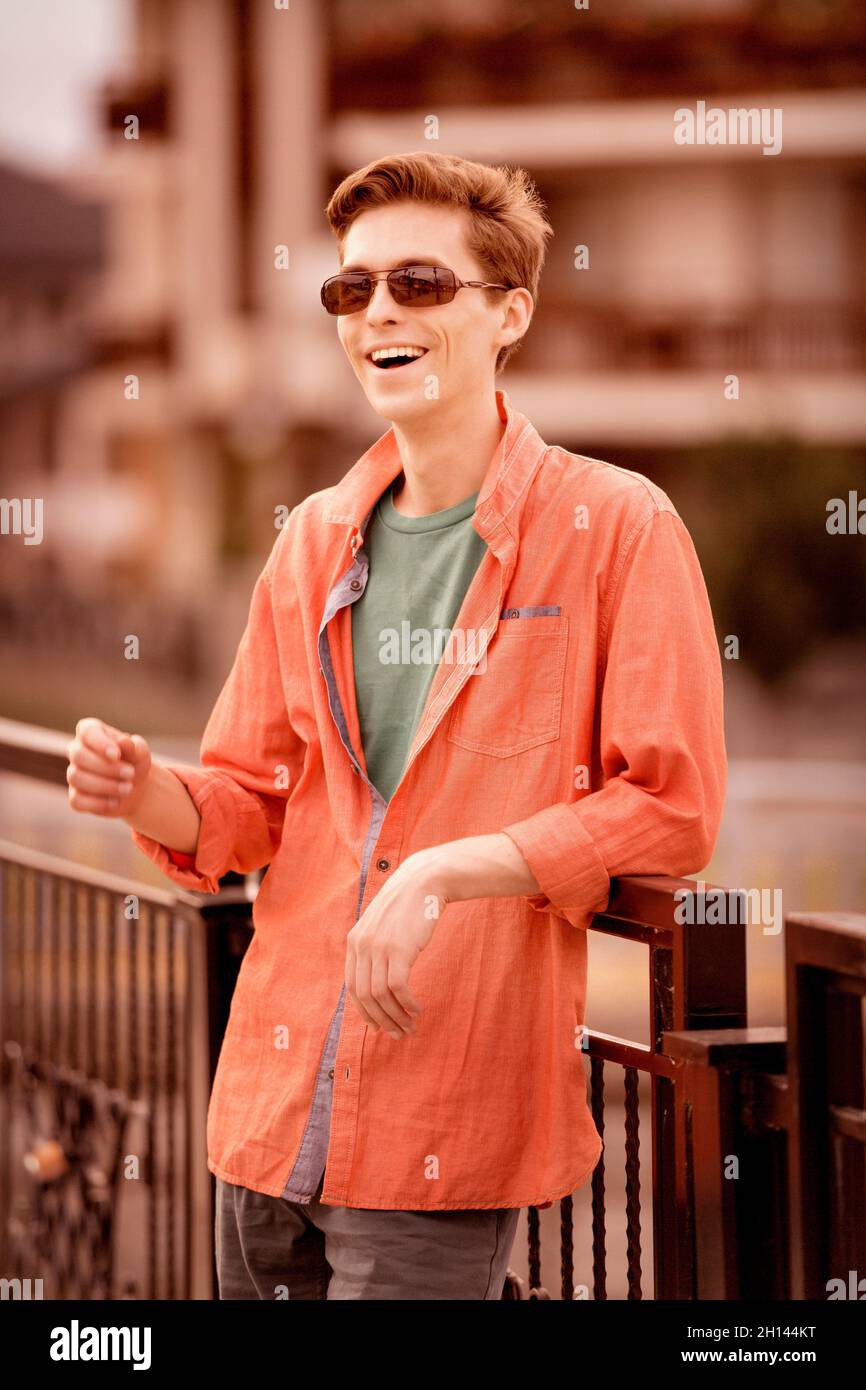 Man in orange shirt hi-res stock photography and images - Alamy