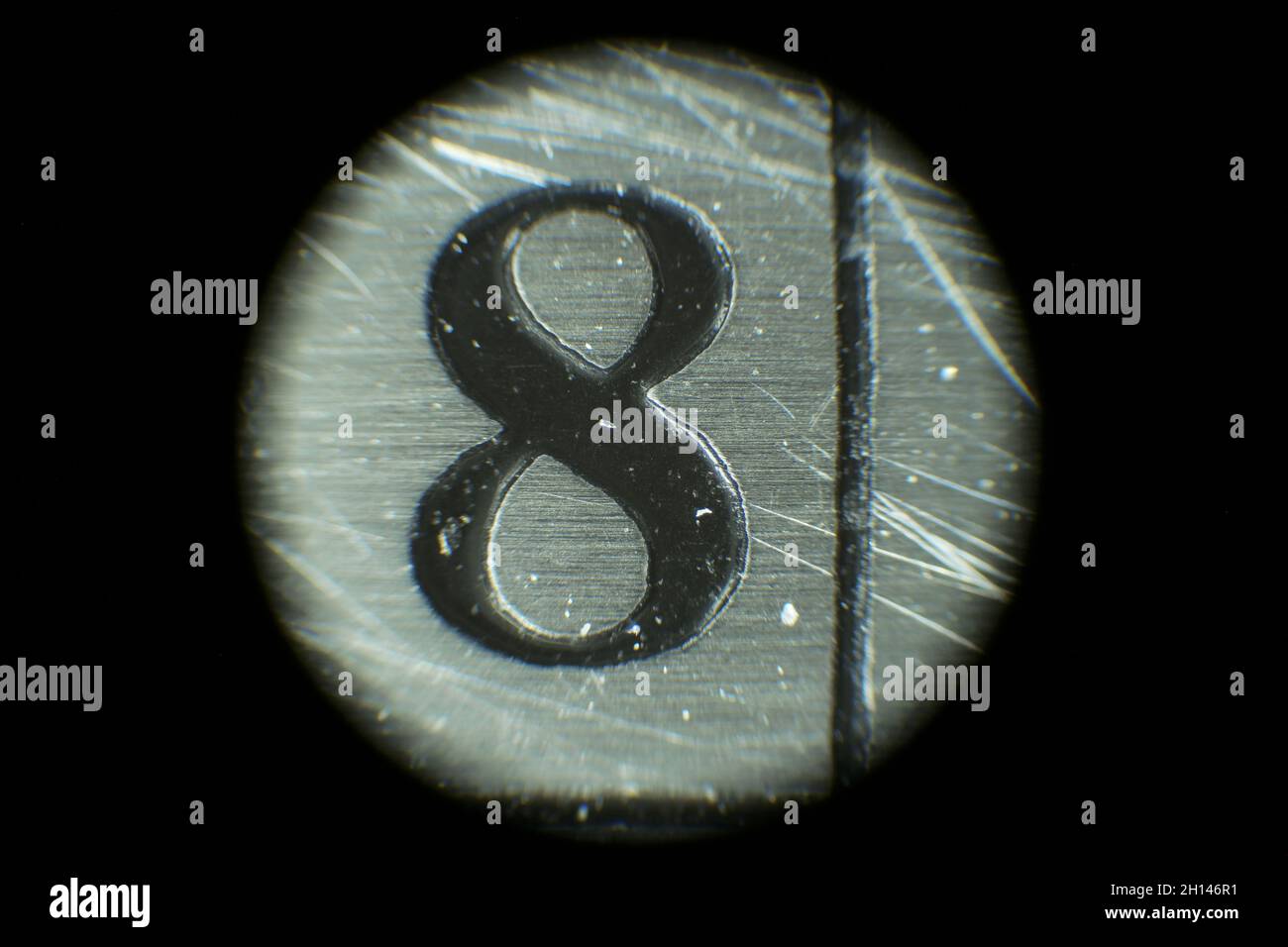 Microscopic view of black number 8 on metal scale Stock Photo - Alamy