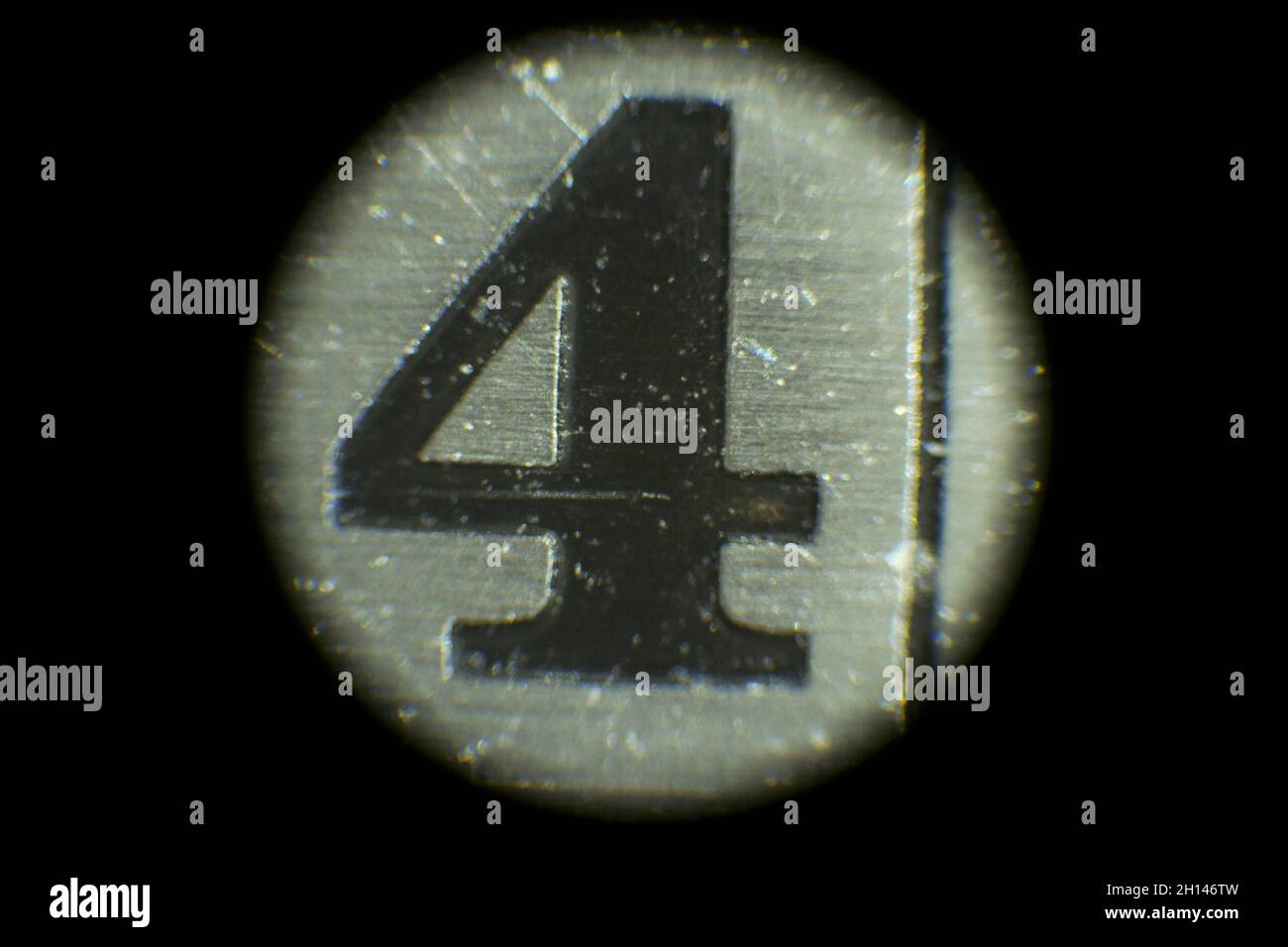 Microscopic view of black number 4 on metal scale Stock Photo - Alamy