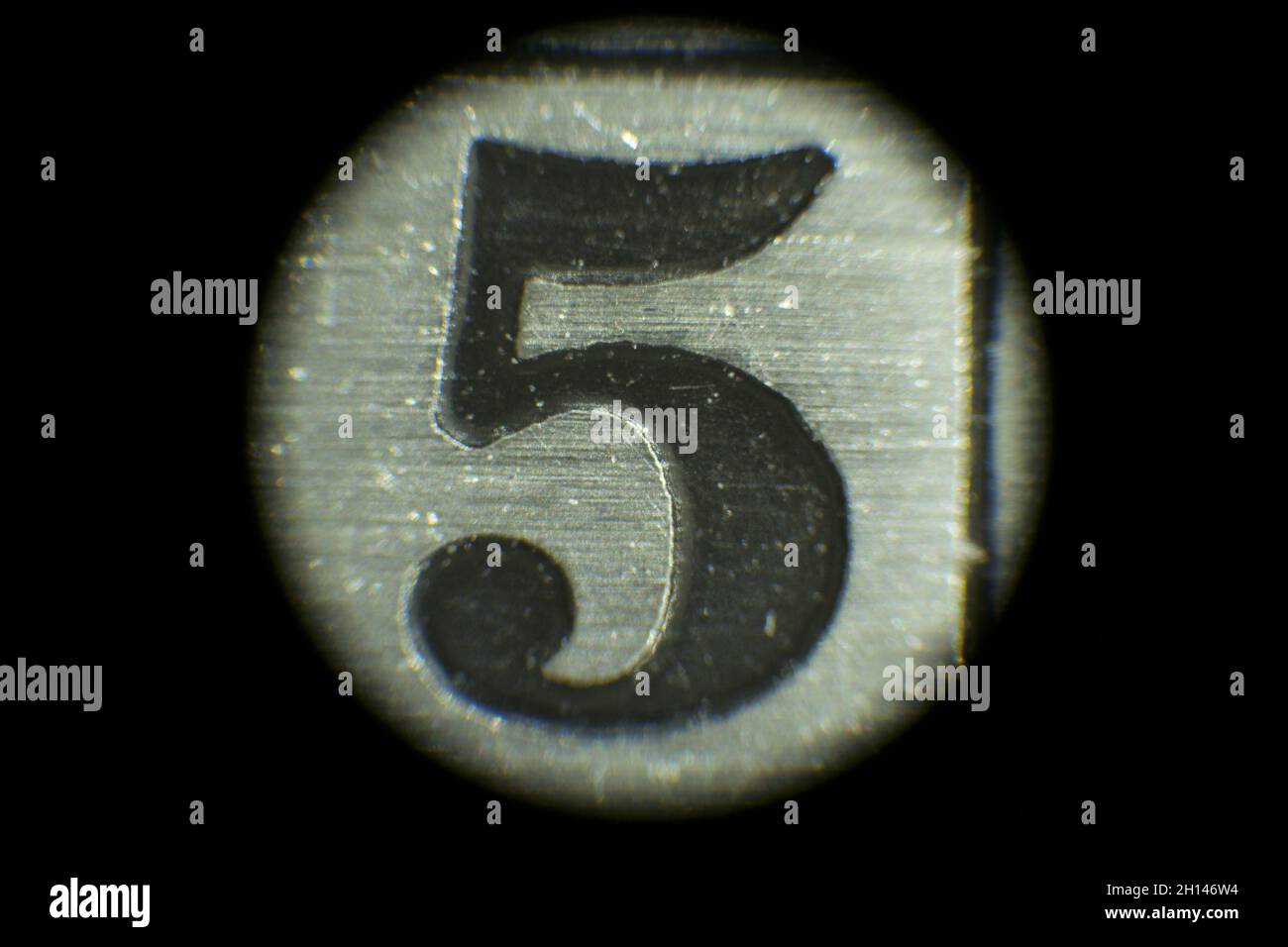 Microscopic view of black number 5 on metal scale Stock Photo - Alamy