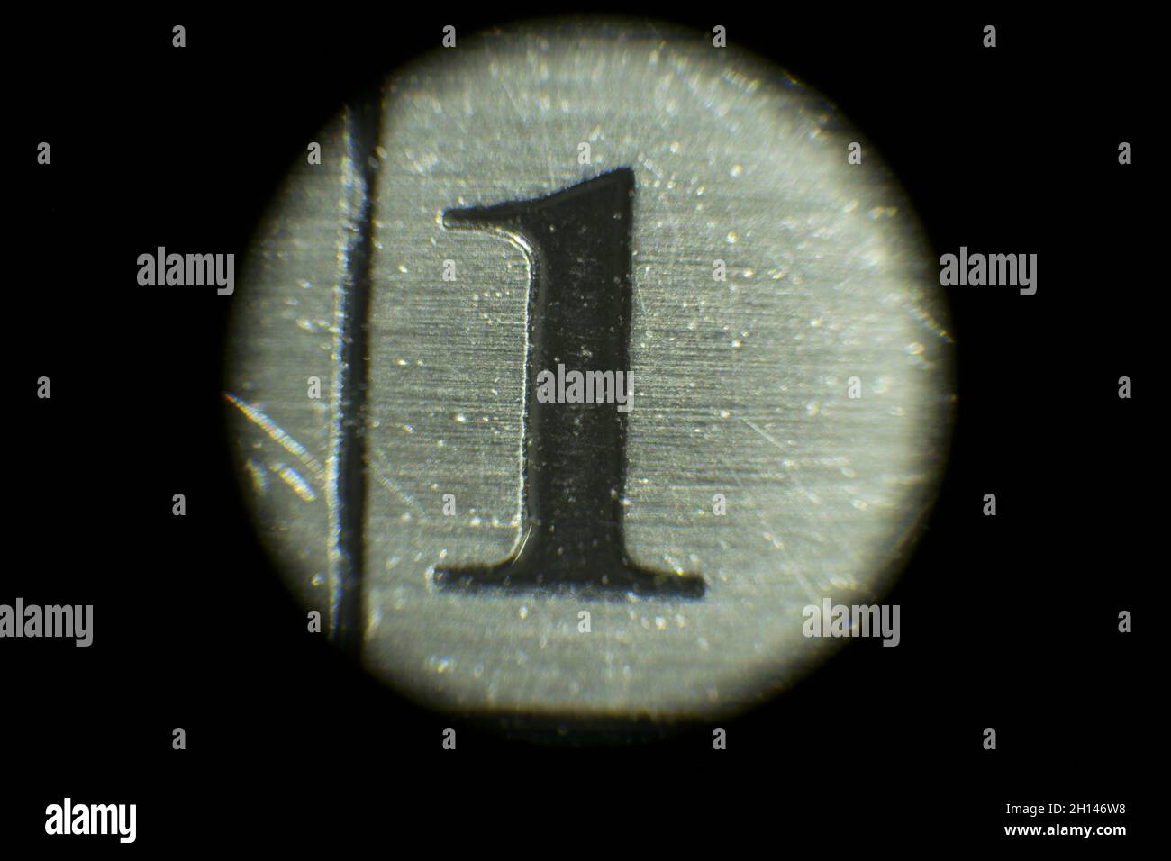 Microscopic view of black number 1 on metal scale Stock Photo - Alamy