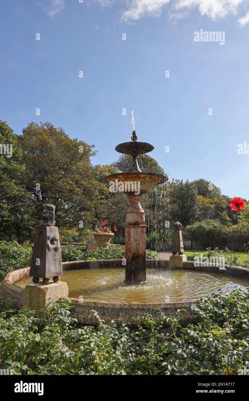 Colourful flower beds surround a fountain in the Rose Garden at ...