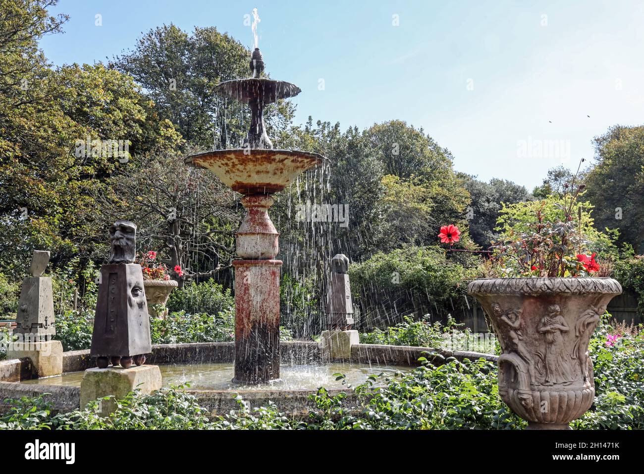 Colourful flower beds surround a fountain in the Rose Garden at ...
