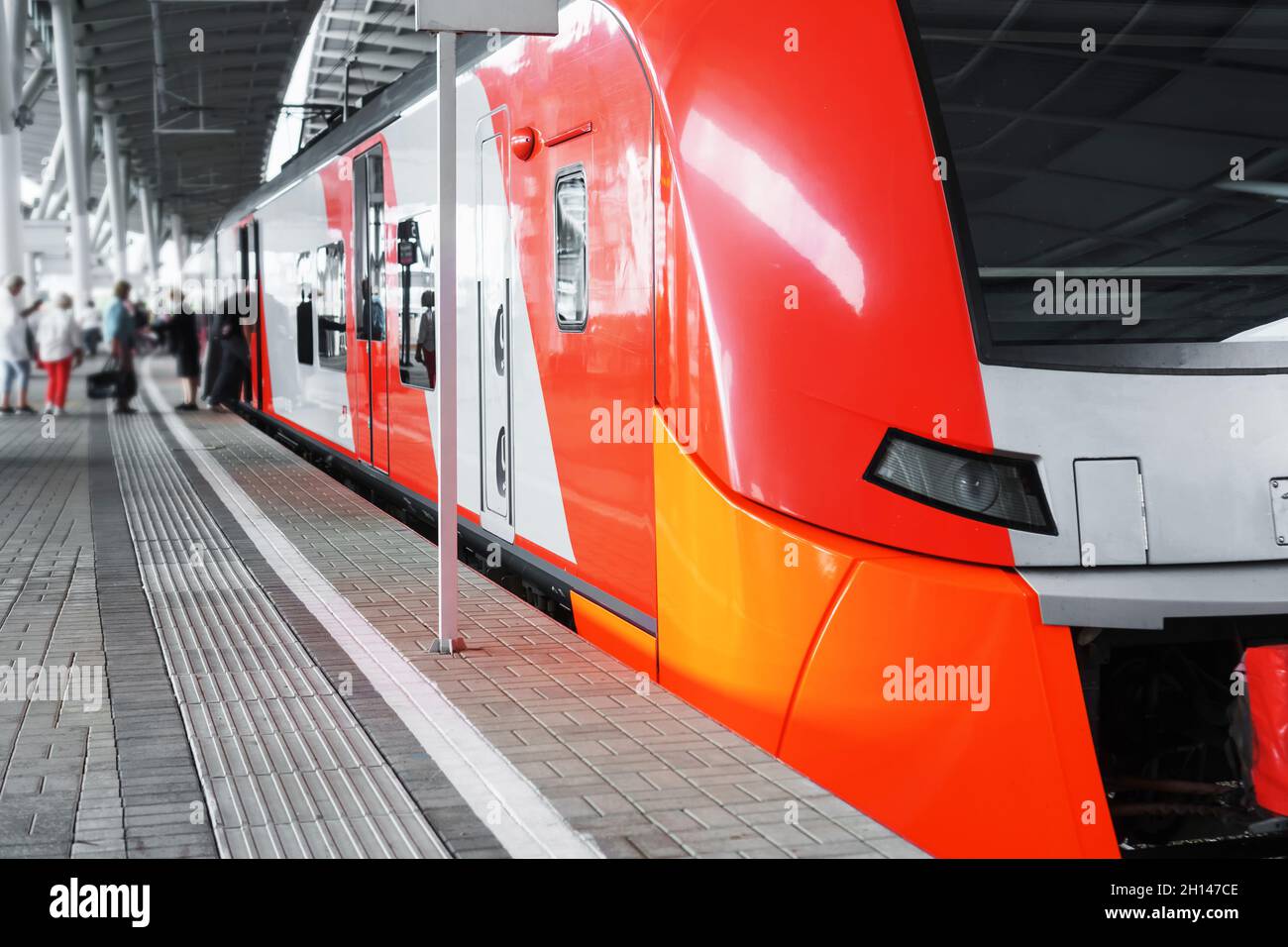 A modern high-speed train stands on a platform Stock Photo - Alamy