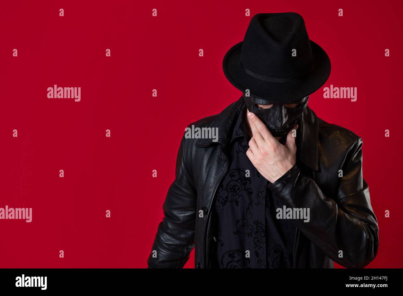 A mysterious ninja assassin in a noir style. A man in black leather ...