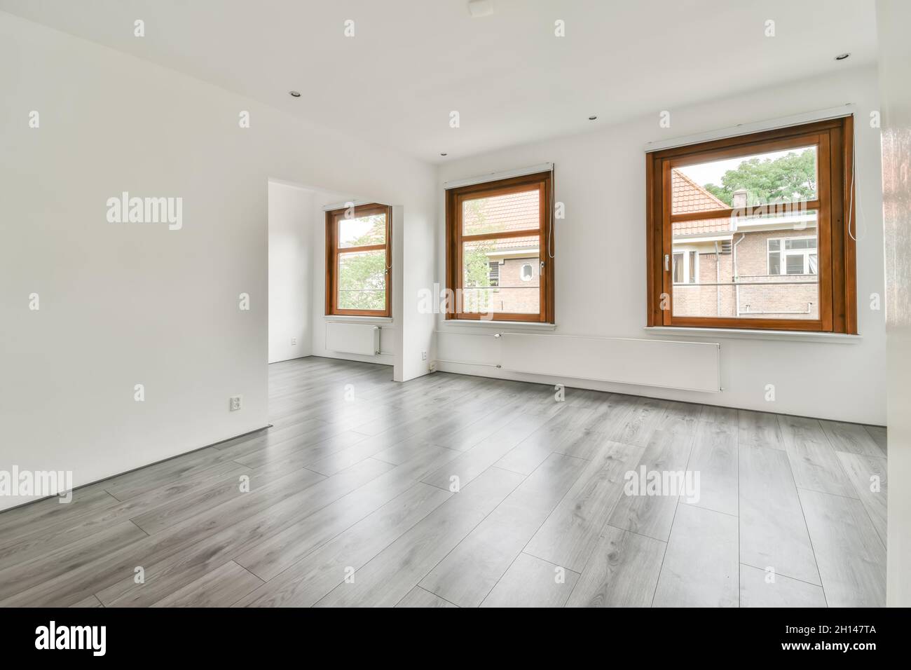 Interior of a white room with windows Stock Photo - Alamy