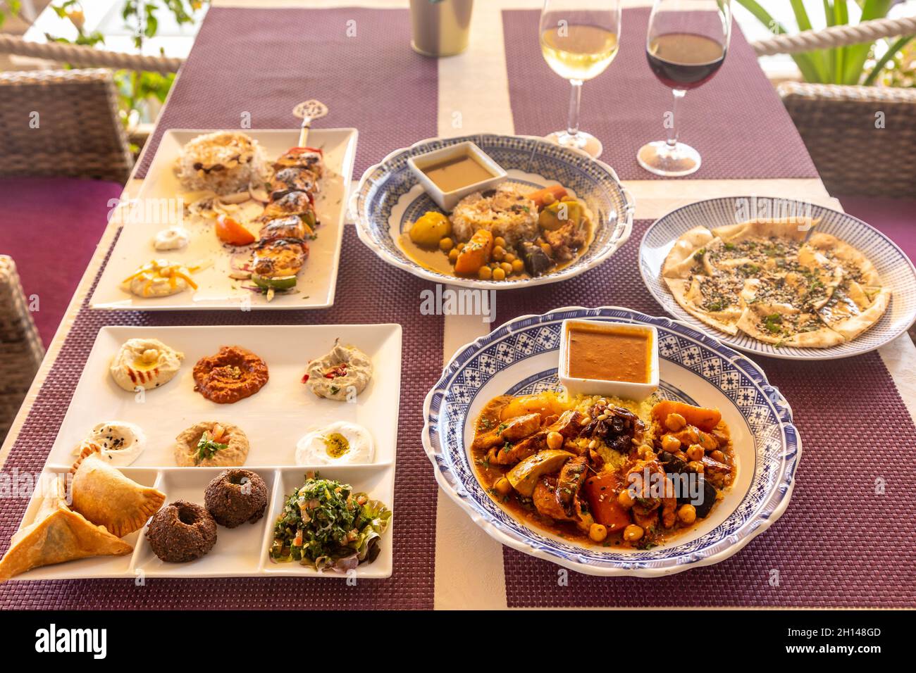 Dinner table with fresh dishes Stock Photo - Alamy