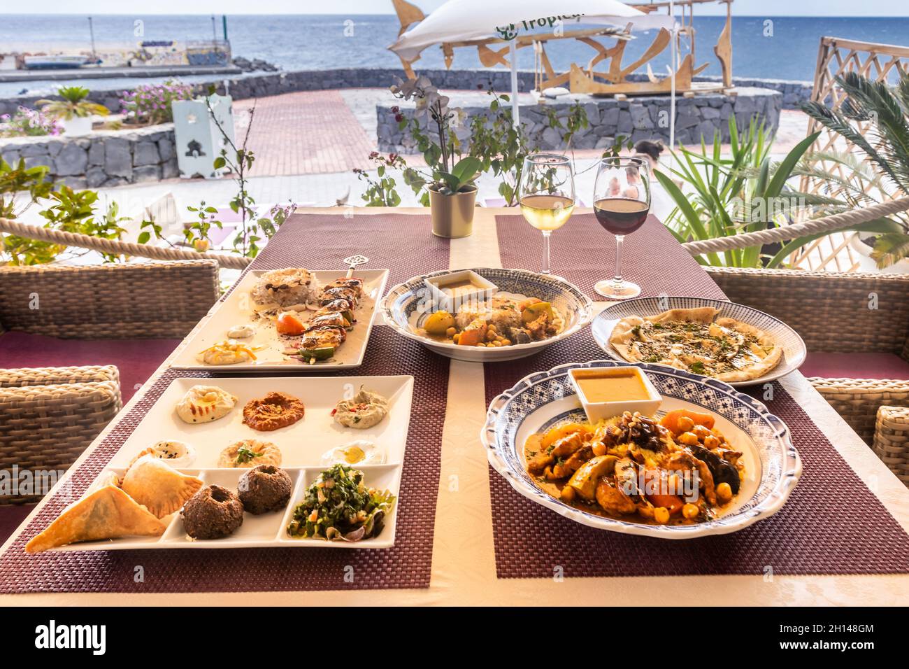 Dinner table with fresh dishes Stock Photo - Alamy