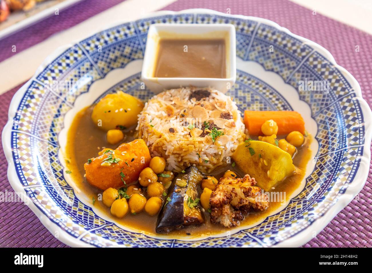 Dinner table with fresh dishes Stock Photo - Alamy