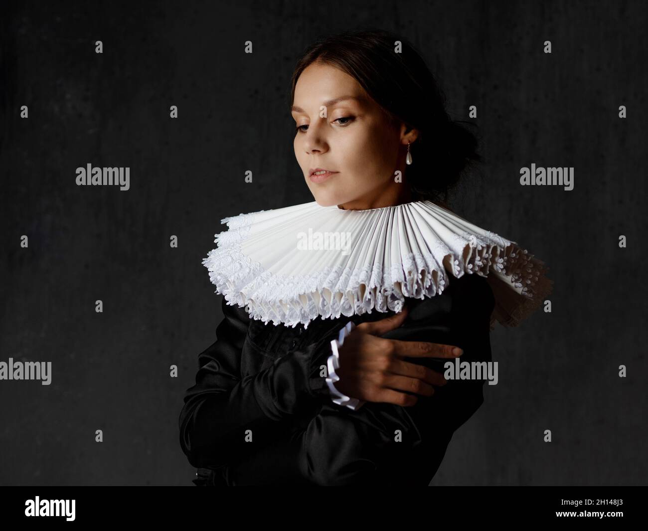 A noble lady in a medieval costume, a young woman in a round Spanish ...