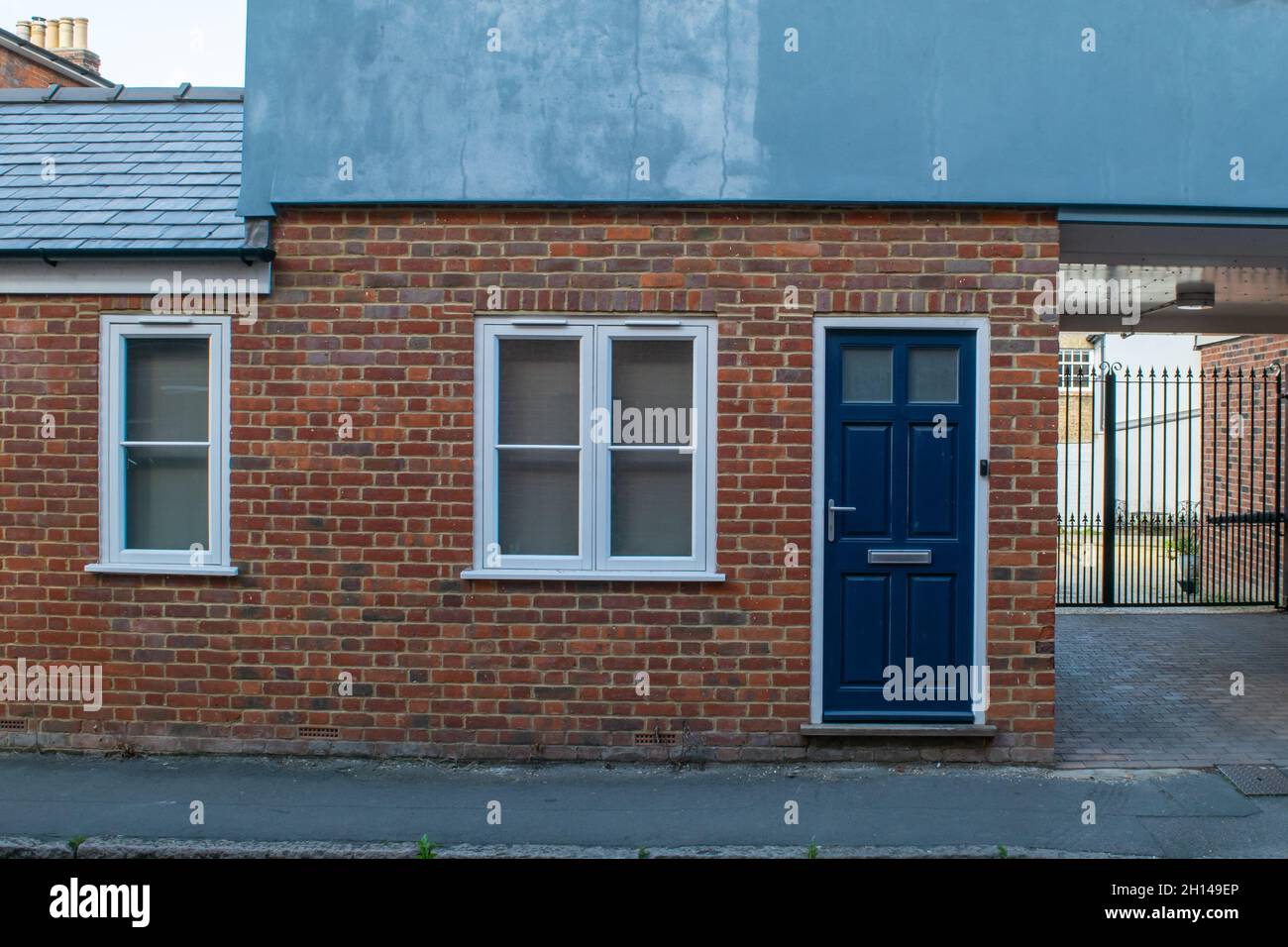 Traditional british brick house with blue door at Saffron Walden ...