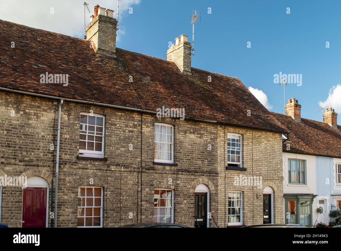 Facade of old traditional terraced cottage brick houses and rooftop at ...