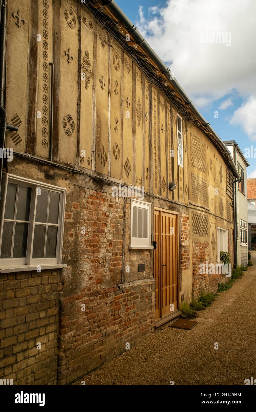 Facade of old brick terraces houses at an alley at Saffron Walden ...