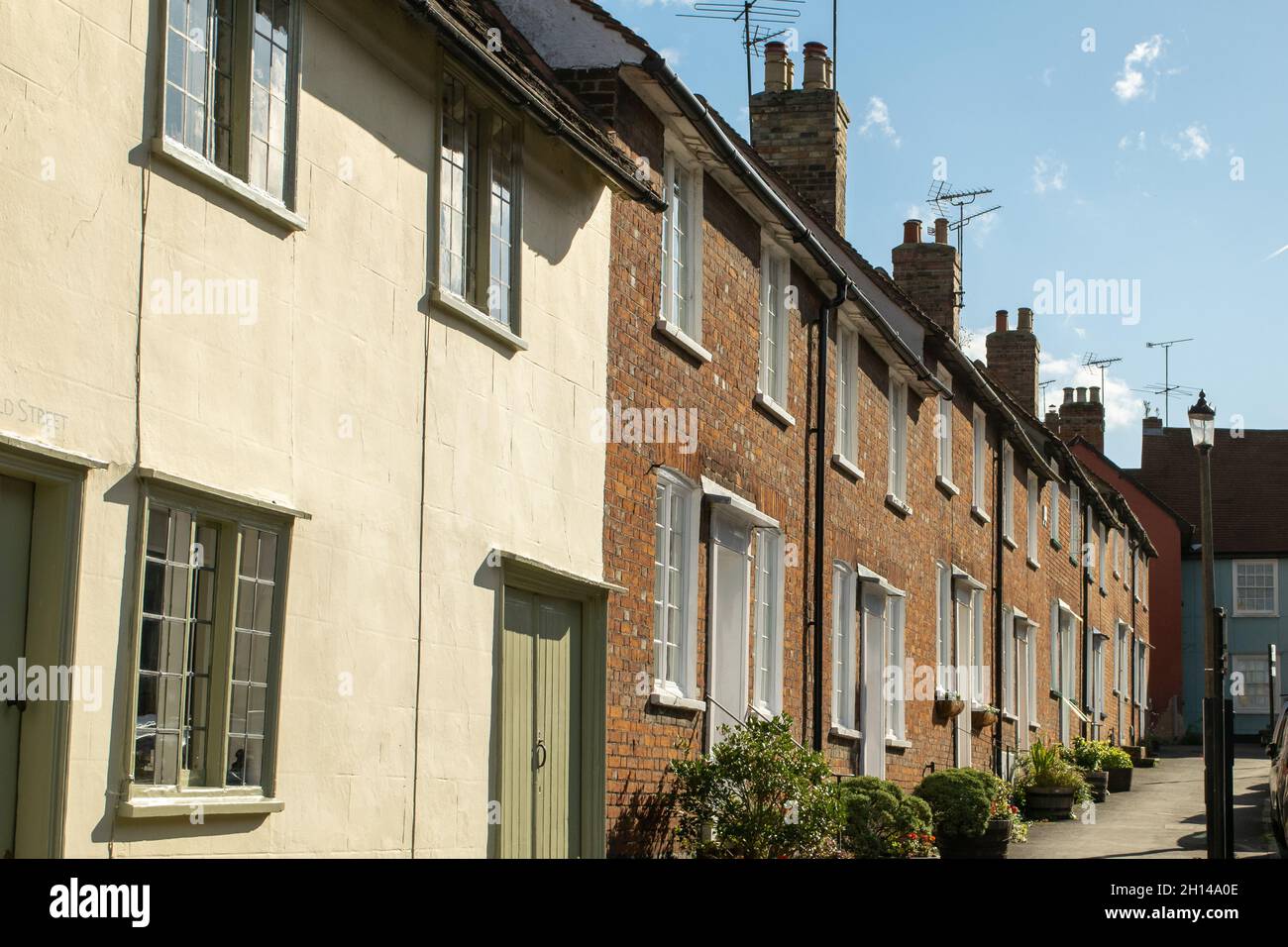 Facade of British terraced brick houses at Saffron Walden, England ...