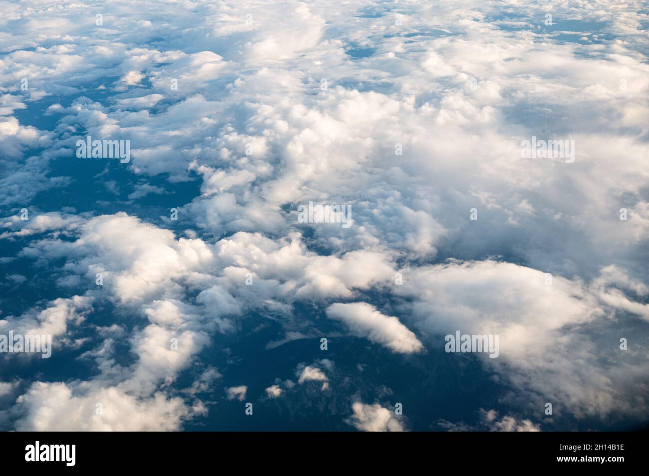 View of airplane flying over clouds hi-res stock photography and images ...