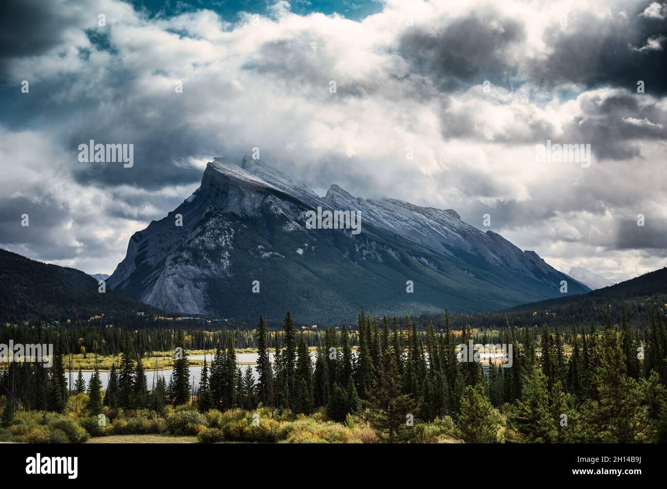 Mount Rundle with dramatic cloud in the forest at Banff national park ...